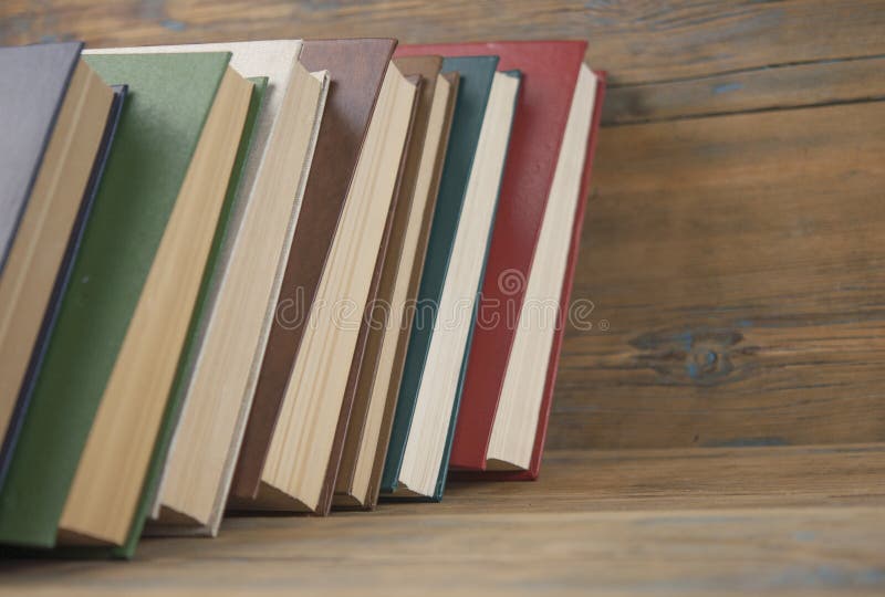 Stack of Books on Wooden Table Over Rustic Background with Copy Space ...