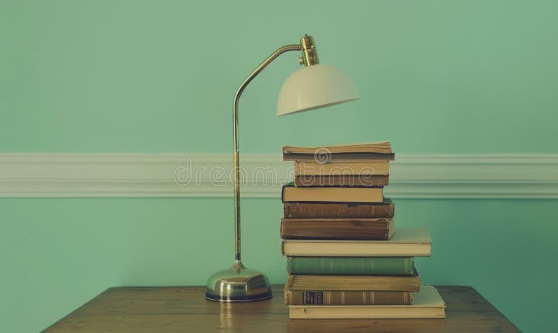 Stack of Books on a Wooden Table with a Pastel Mint Green Background ...