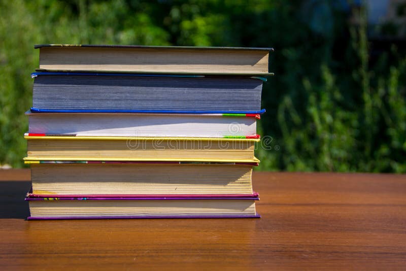 Stack of the Books on Wooden Table Stock Photo - Image of brown, green ...