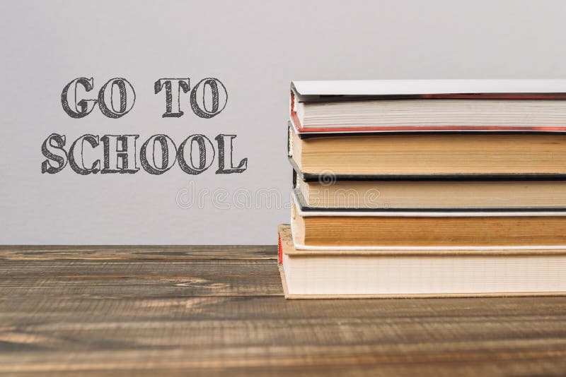A Stack of Books with the Word Go To School Written on Top Stock Image ...