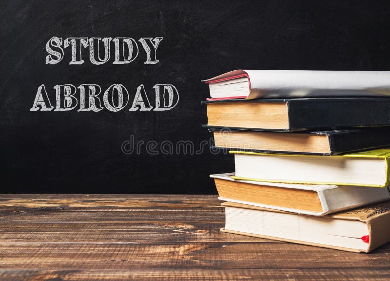 A Stack of Books with the Word Study Abroad Written on Top Stock Photo ...