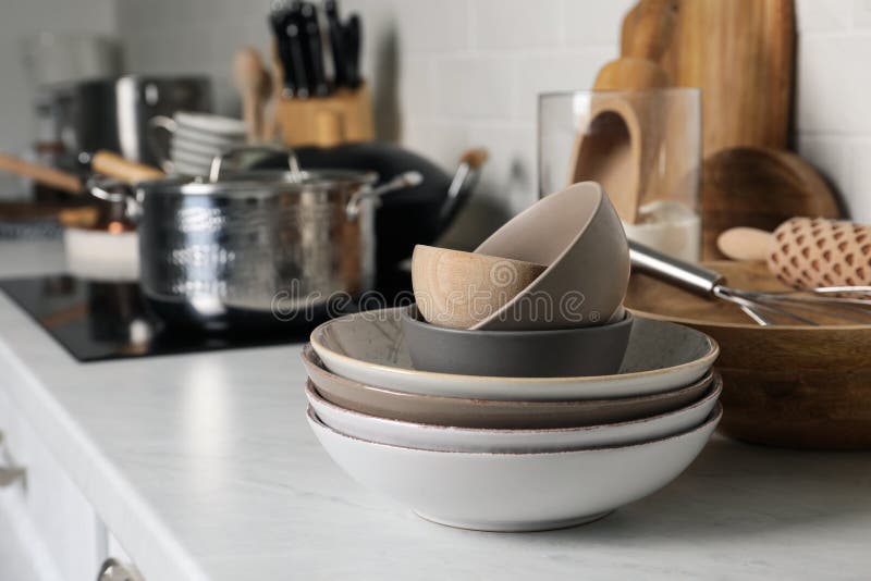 Stack of Bowls and Different Cooking Utensils on Countertop in Kitchen ...