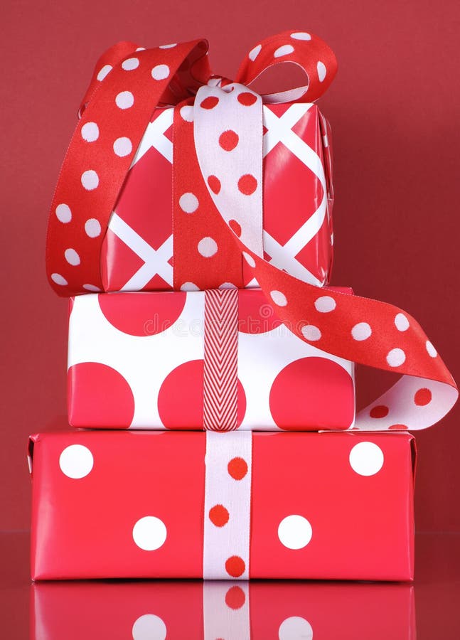 Stack of Red and White Polka Dot Theme Festive Gift Box Presents with ...
