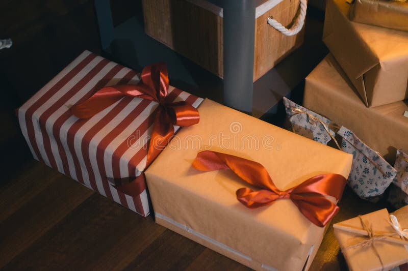 A Stack of Brown Boxes Tied Up in Bows on the Ground Stock Photo ...