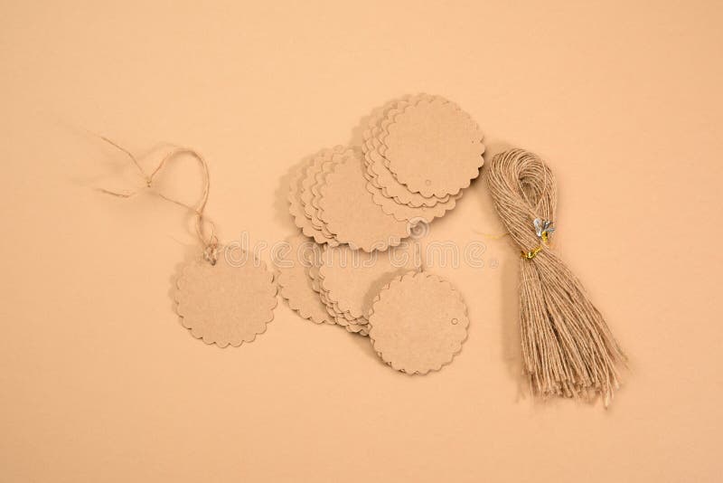 Stack of Brown Paper Tags and Rope Stock Photo - Image of empty, retail ...