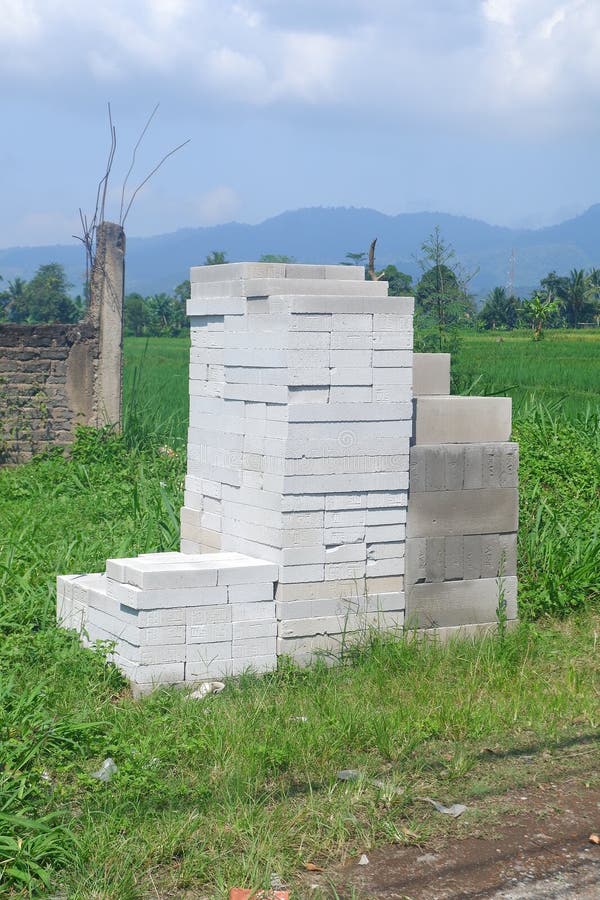 Stack of Building Blocks in Rural Landscape with Greenery Stock Photo ...