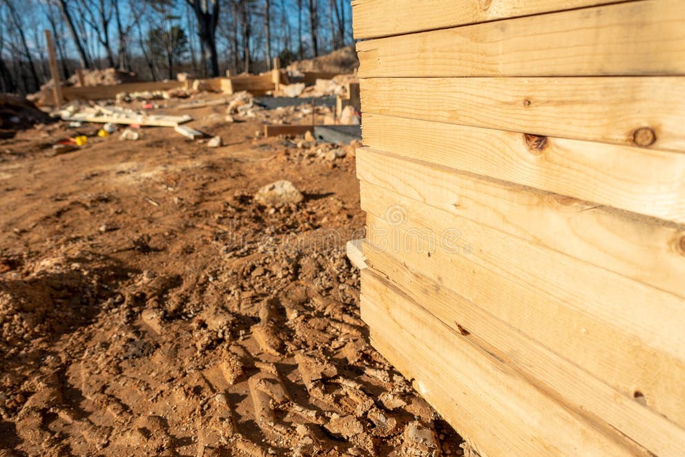 Stack of Building Lumber at Construction Site Stock Photo - Image of ...