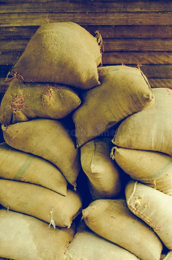 A Stack of Burlap Sacks Piled on Top of Each Other, Worn and are ...