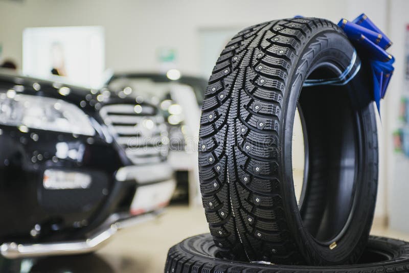 Stack of Car Tires in the Showroom. New Cars in Stock Photo - Image of ...
