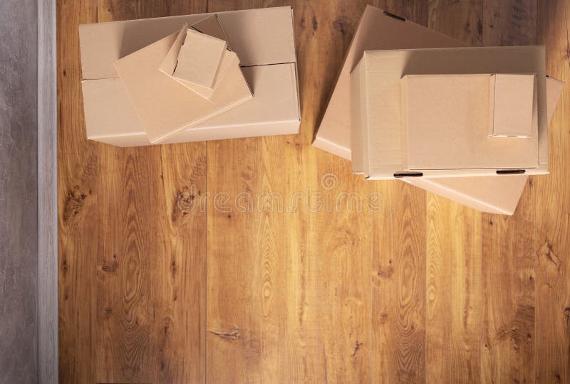 Stack of Cardboard Box on Floor Laminate Background. Empty Box Case Top ...