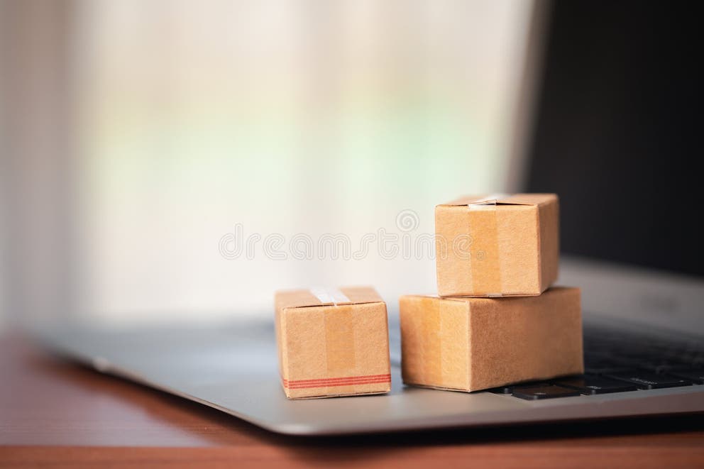 Stack of Cardboard Boxes on a Laptop Keyboard Stock Photo - Image of ...
