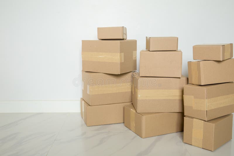 Stack of Cardboard Boxes for Moving, Empty Room with a White Wall and ...