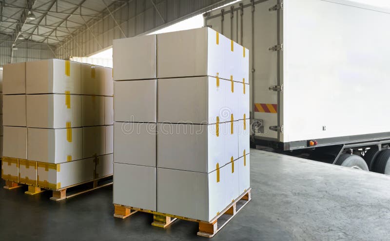 Stack of Cardboard Boxes on Pallet Rack Load into Shipping Container ...
