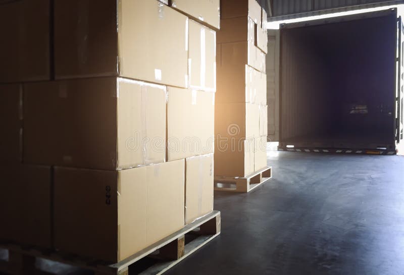 Stack of Cardboard Boxes on Pallet Rack in Warehouse Storage. Shipment ...