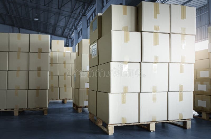 Stack of Shipment Boxes Wrapping Plastic on Wooden Pallets at Interior ...
