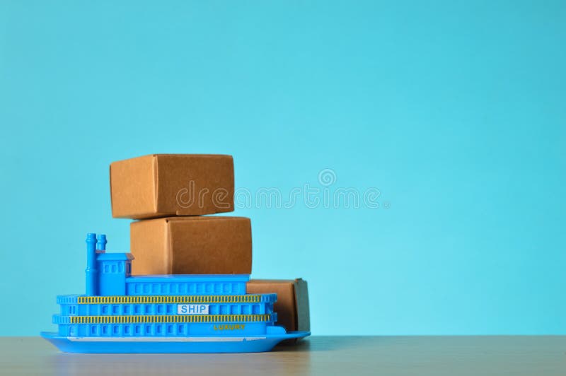 Stack of Cardboard Boxes and Toy Cargo Ship with Fast Delivery of Goods ...