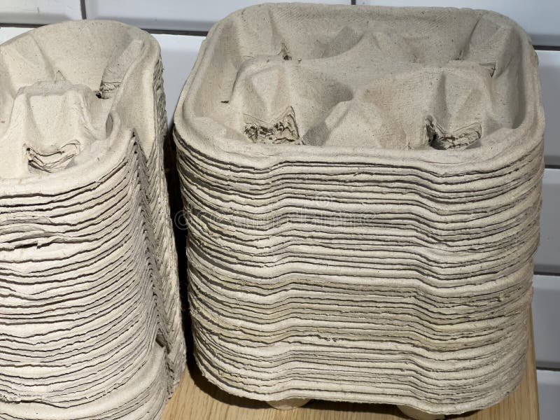 A Stack of Cardboard Cup Holders Sit on a Wooden Counter Stock Image ...