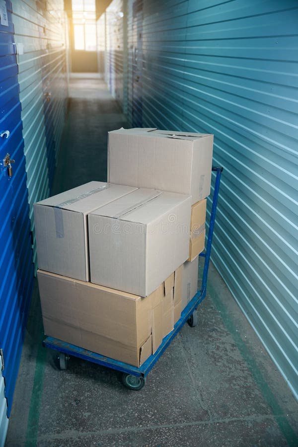 Stack of Cardboard Moving Boxes in the Hallway Stock Photo - Image of ...