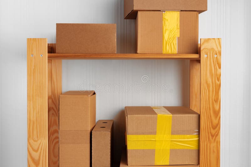 Stack of Cardboard Package Boxes on Wooden Rack Stock Image - Image of ...