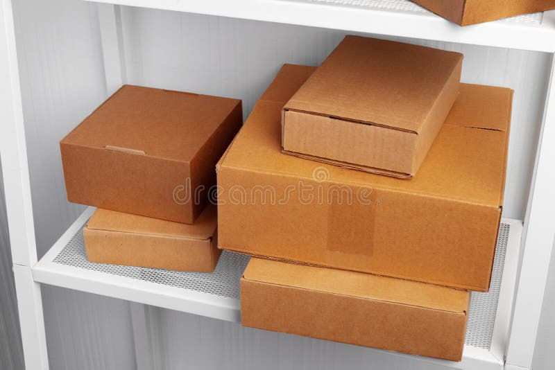 Stack of Cardboard Package Boxes on Wooden Rack Stock Photo - Image of ...