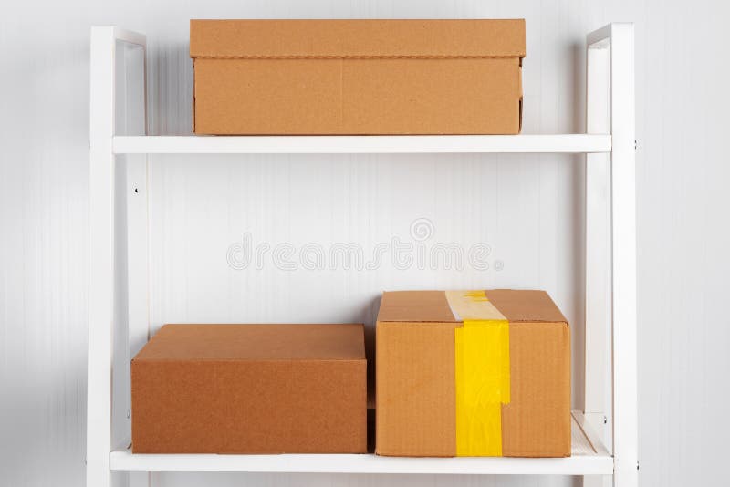Stack of Cardboard Package Boxes on Wooden Rack Stock Image - Image of ...