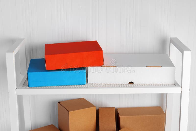 Stack of Cardboard Package Boxes on Wooden Rack Stock Photo - Image of ...