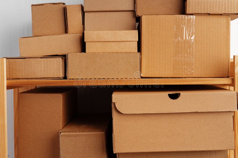 Stack of Cardboard Package Boxes on Wooden Rack Stock Photo - Image of ...