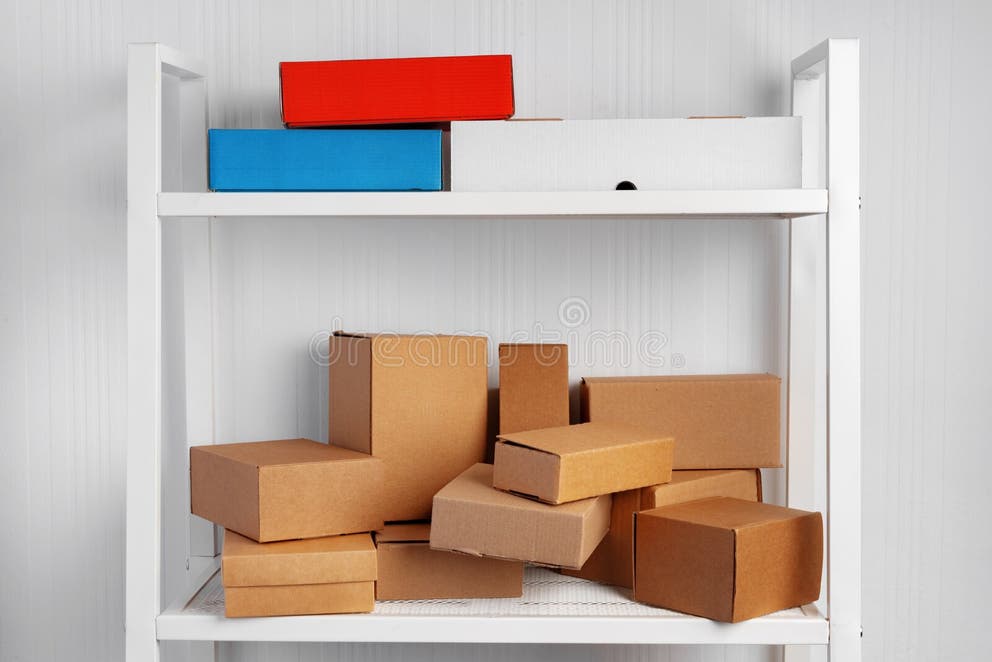 Stack of Cardboard Package Boxes on Wooden Rack Stock Image - Image of ...