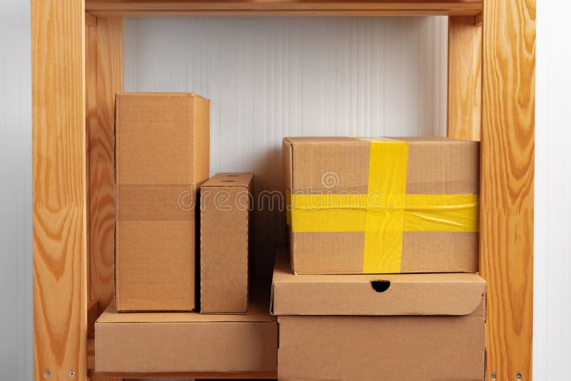 Stack of Cardboard Package Boxes on Wooden Rack Stock Image - Image of ...