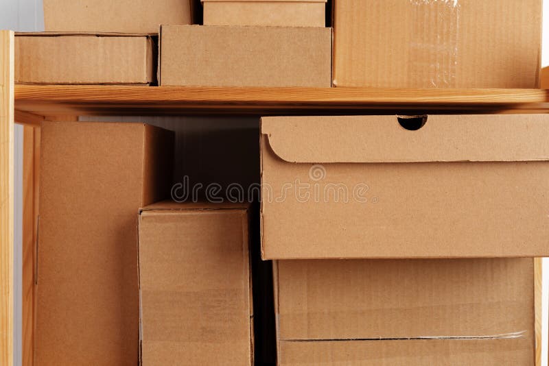 Stack of Cardboard Package Boxes on Wooden Rack Stock Image - Image of ...