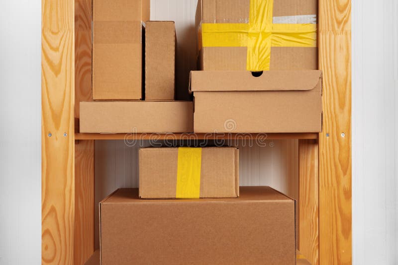 Stack of Cardboard Package Boxes on Wooden Rack Stock Photo - Image of ...