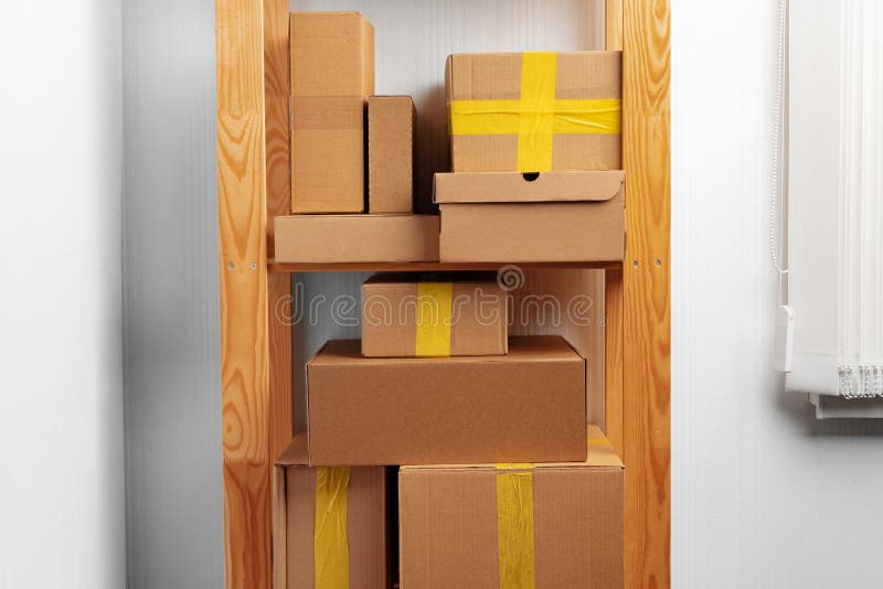 Stack of Cardboard Package Boxes on Wooden Rack Stock Photo - Image of ...