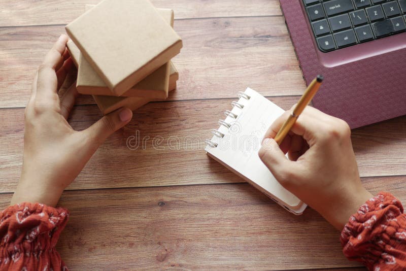 Stack of Cardboard Parcels and Laptop on Table Stock Photo - Image of ...