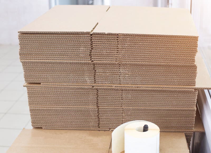 A Stack of Cardboard Sheets for Packing Boxes in Production. Pulp ...