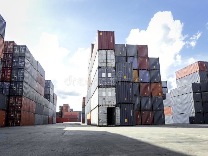 Stack of Cargo Container Box in Logistic Shipping Yard Whit Blue Sky on ...