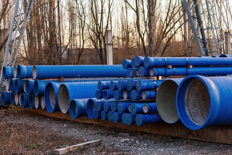 Stack of Cast Iron Pipes in Loading Area Waiting for Transportation ...