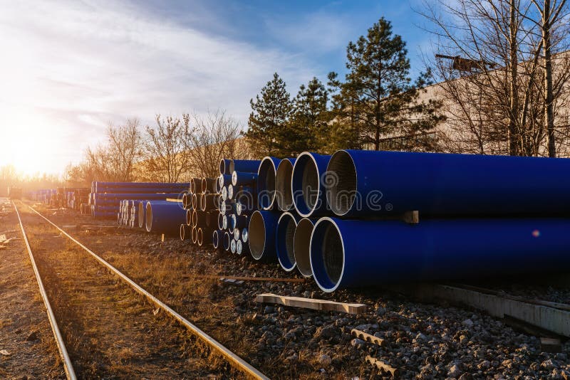 Stack of Cast Iron Pipes in Loading Area Waiting for Transportation ...