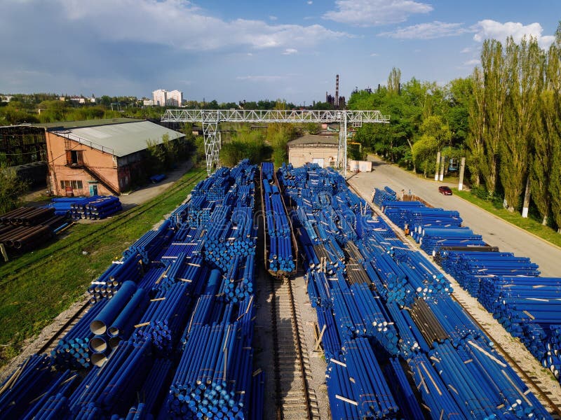 Stack of Cast Iron Pipes in Loading Area Waiting for Transportation ...