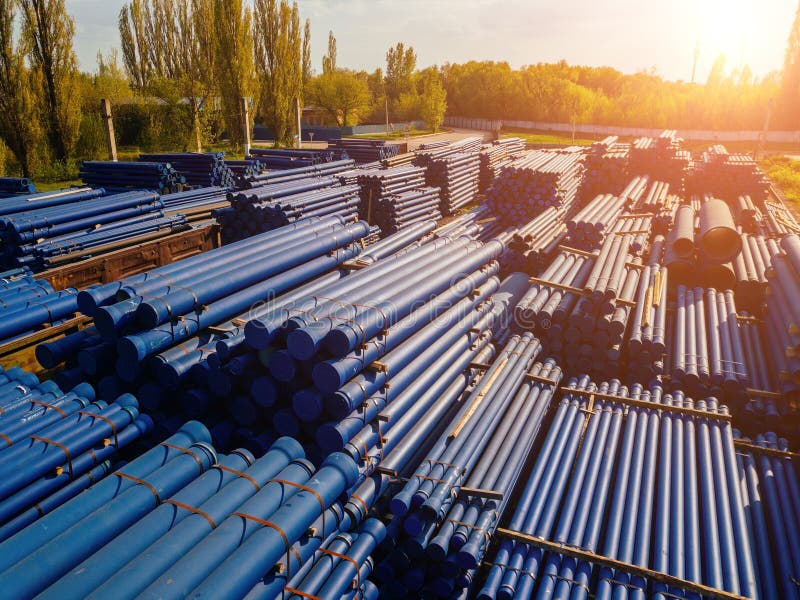 Stack of Cast Iron Pipes in Loading Area Waiting for Transportation ...