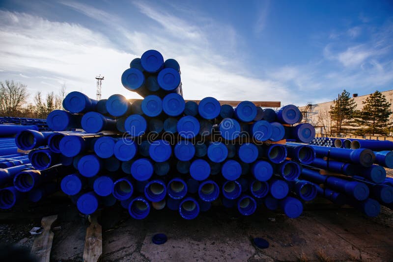 Stack of Cast Iron Pipes in Loading Area Waiting for Transportation ...
