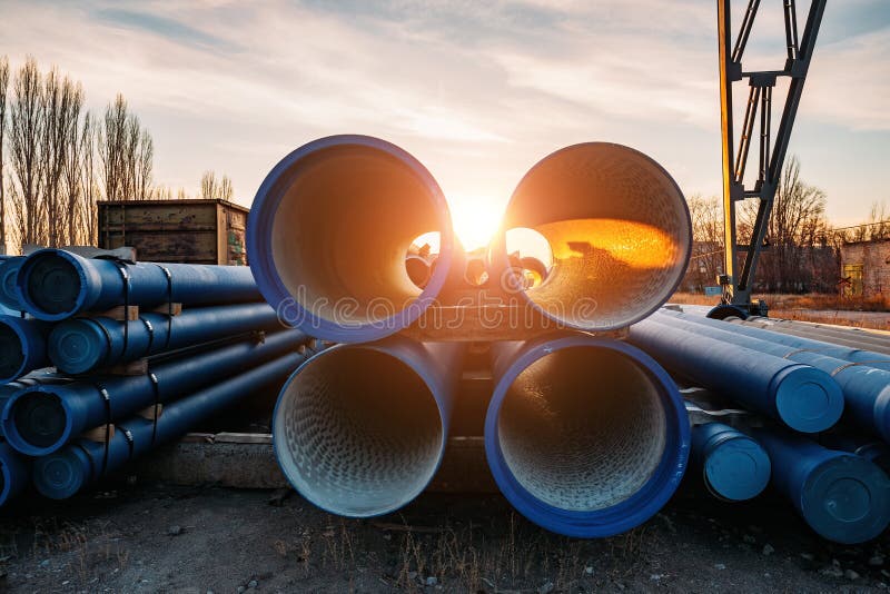 Stack of Cast Iron Pipes in Loading Area Waiting for Transportation ...