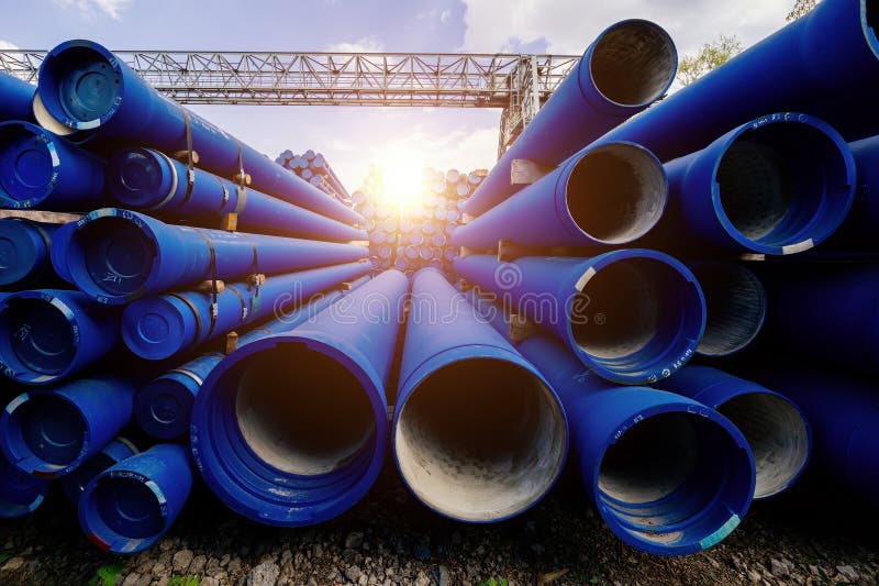 Stack of Cast Iron Pipes in Loading Area Waiting for Transportation ...
