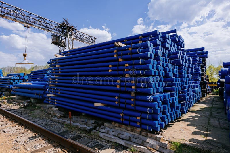 Stack of Cast Iron Pipes in Loading Area Waiting for Transportation ...