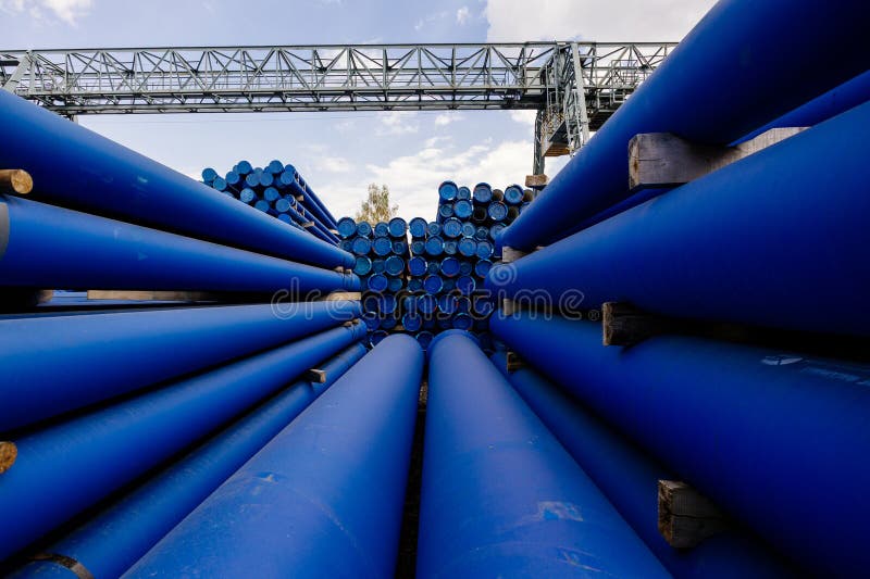 Stack of Cast Iron Pipes in Loading Area Waiting for Transportation ...
