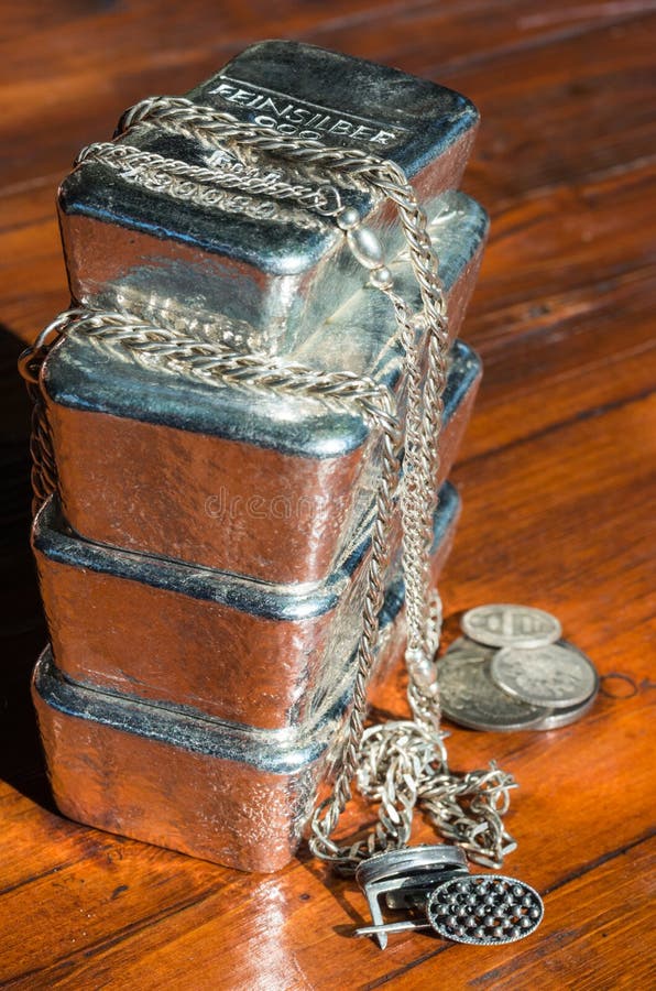 A Stack of Cast Silver Bars, Coins and Jewelry Stock Photo - Image of ...
