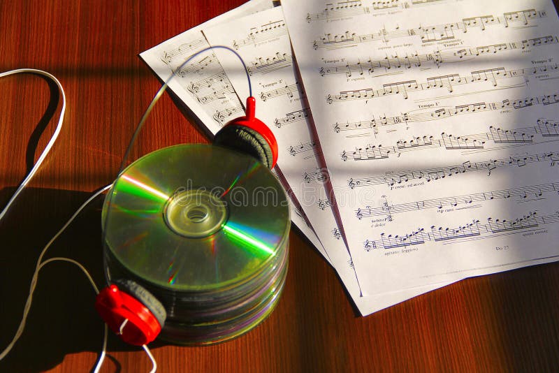 Stack of CDs with Headphone and Musical Notes Stock Photo - Image of ...