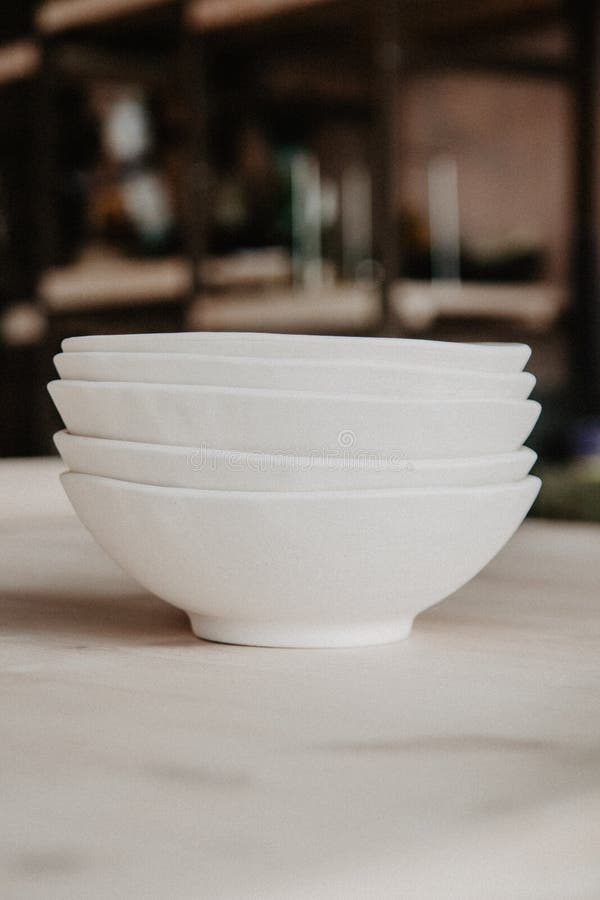 Stack of Ceramic Plates on Cozy Back Stock Photo - Image of abstract ...