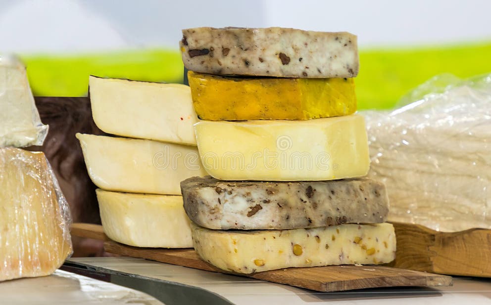 Stack of cheese on market stock photo. Image of organic - 290760094