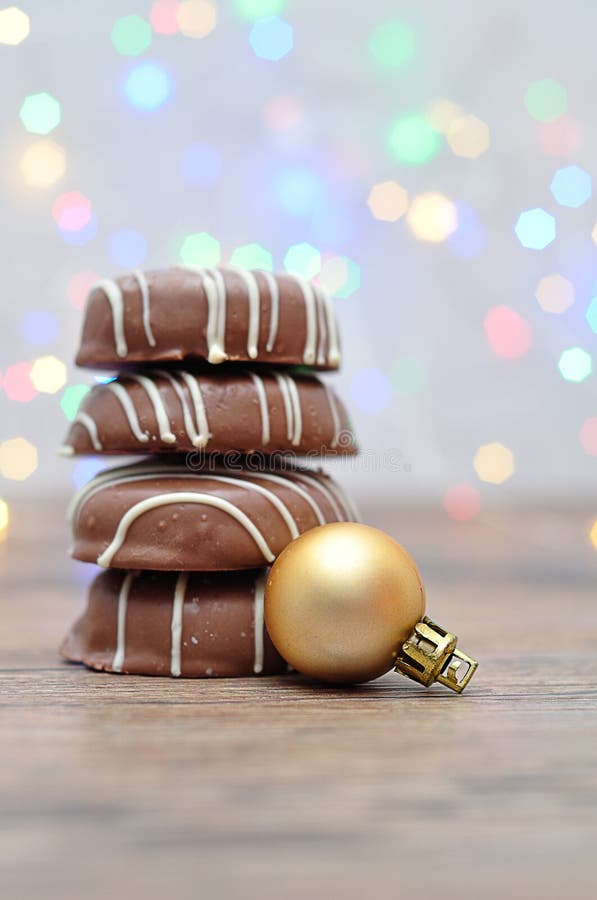 A Stack of Chocolate Covered Biscuits and a Golden Babble Stock Image ...
