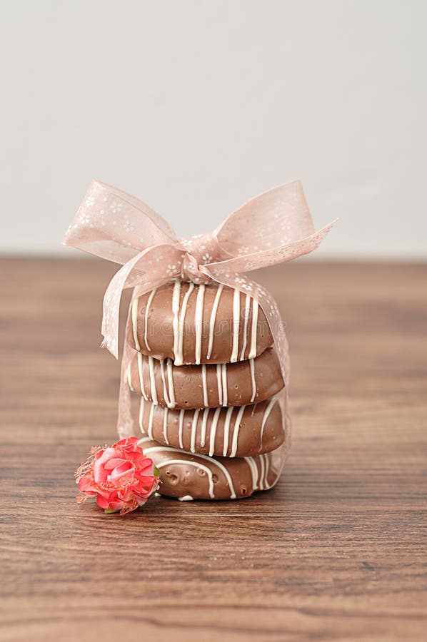 A Stack of Chocolate Covered Biscuits Tied with a Pink Ribbon Stock ...